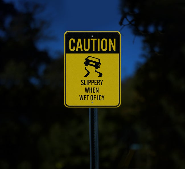 Slippery When Wet Road Sign